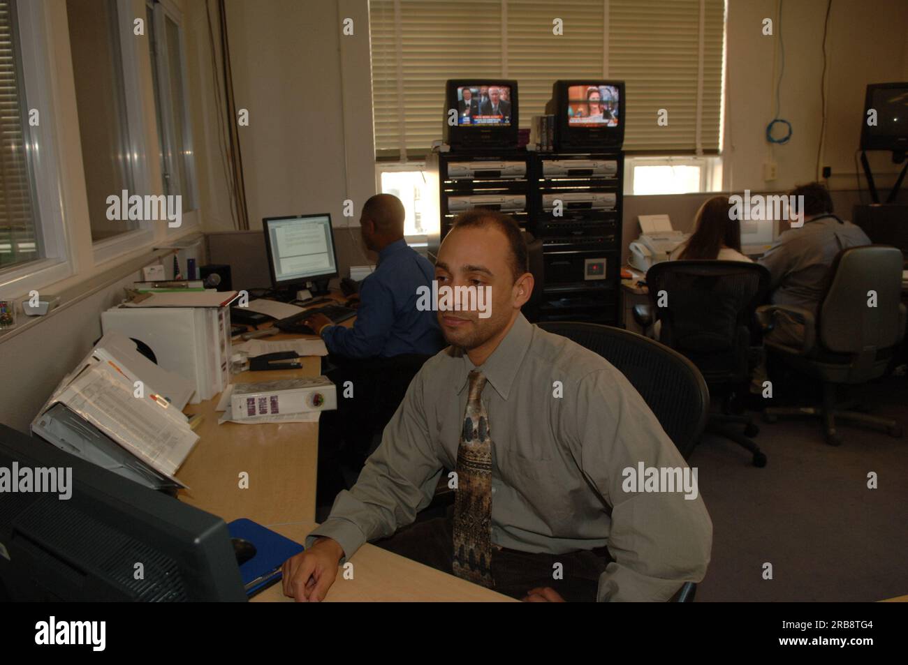 Staff at terminals, Interior Watch Office Stock Photo - Alamy
