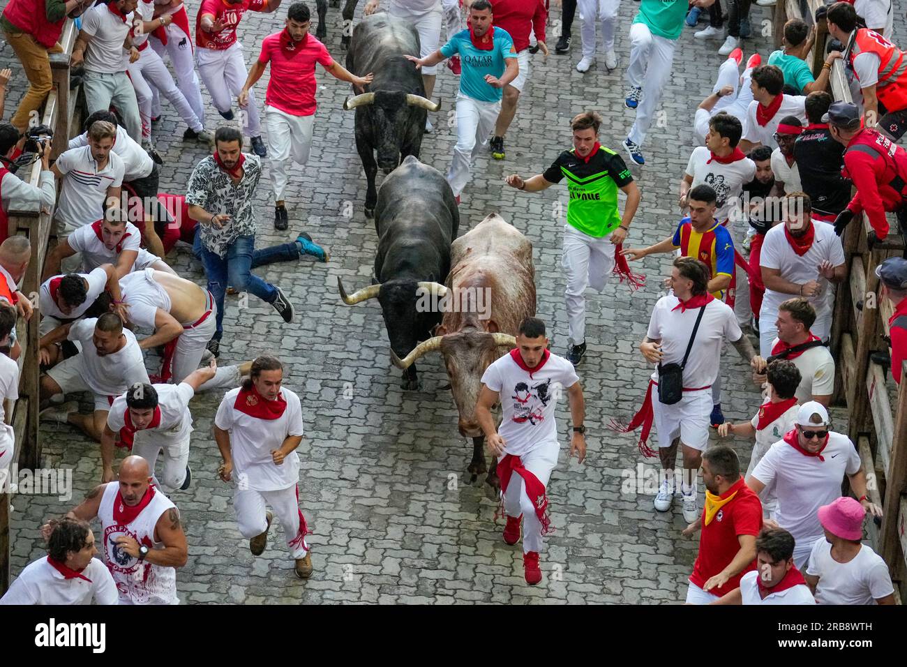 Pamplona, Spain. 08th July, 2023. Bull runners take cover near the ...