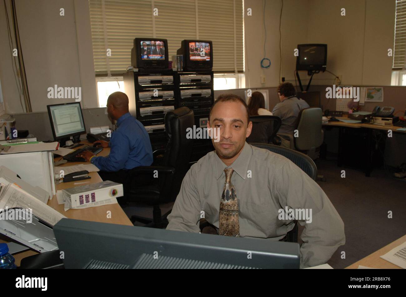 Staff at terminals, Interior Watch Office Stock Photo - Alamy