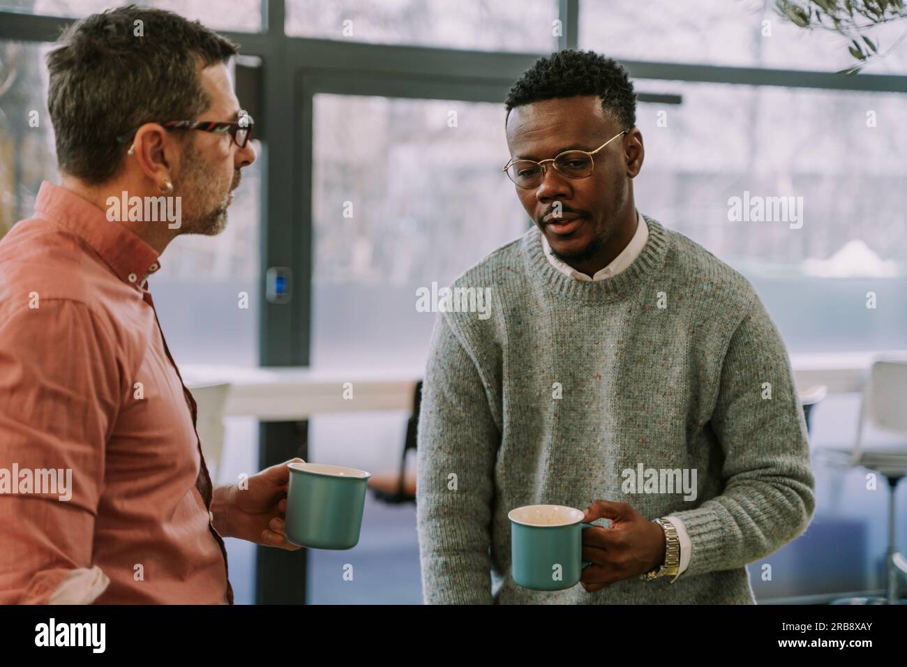 Two diverse coworkers making a plan for their next client on the ...