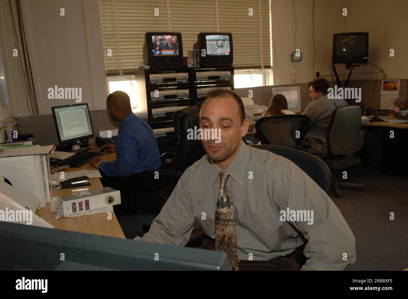 Staff at terminals, Interior Watch Office Stock Photo - Alamy