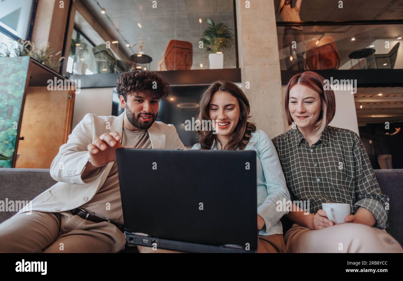 Employees having fun and laughing during an online meeting with a funny ...