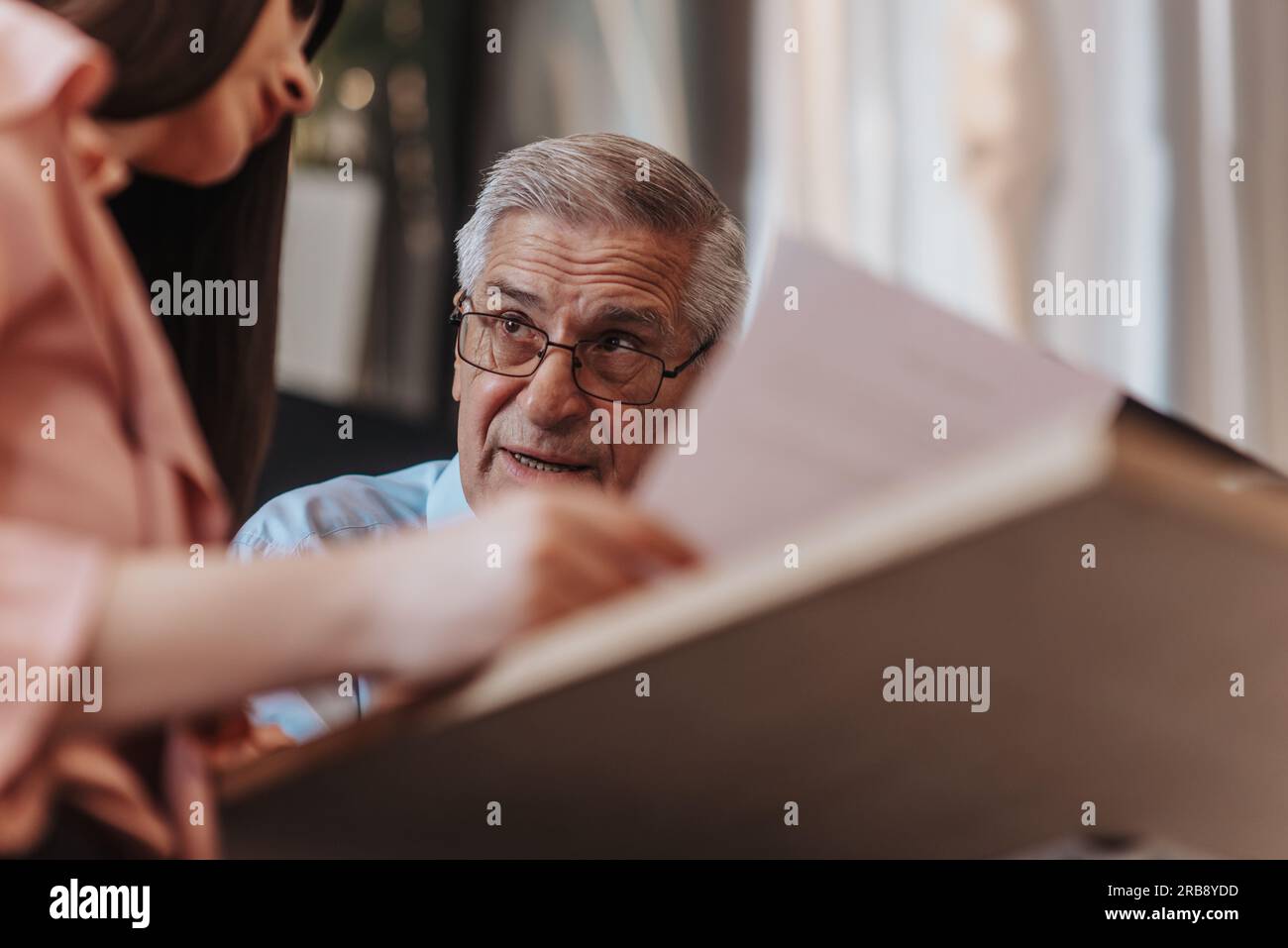 Mature company boss telling tips and tricks to a business client for ...