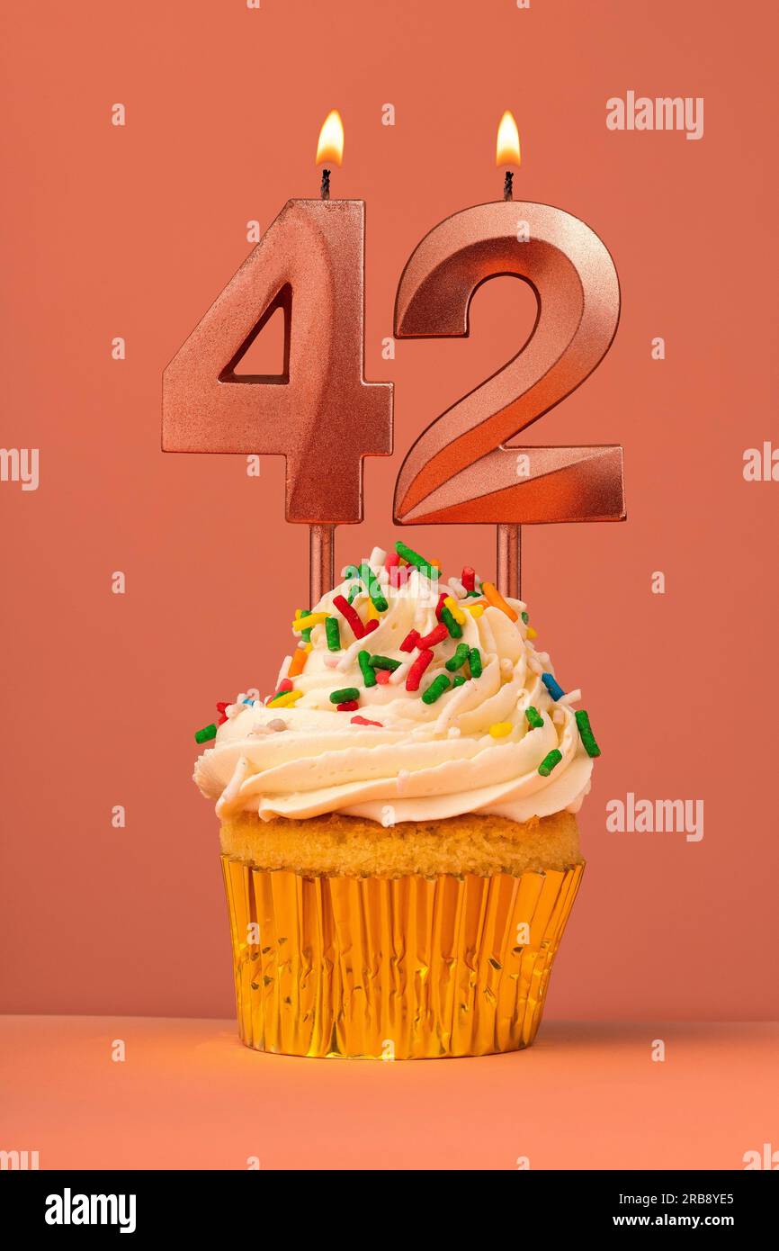 Candle number 42 - Cake birthday in coral fusion background Stock Photo ...