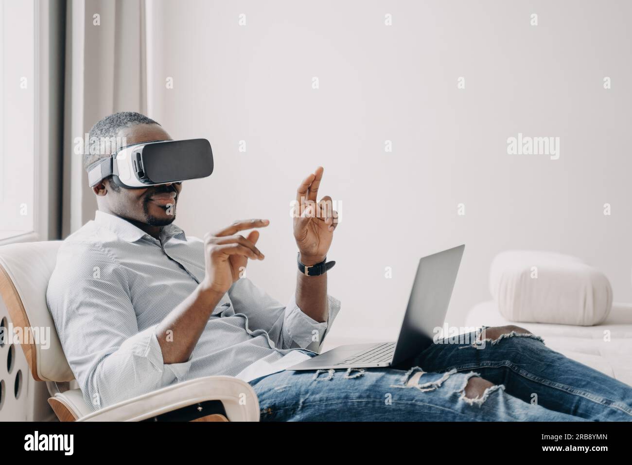 African american male software developer in virtual reality glasses ...