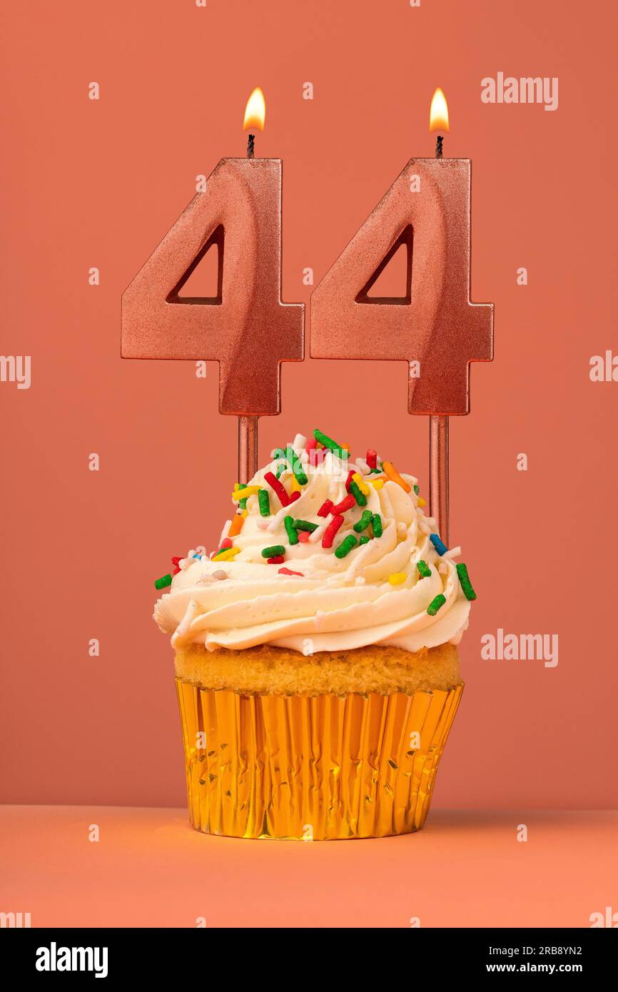 Candle number 44 - Cake birthday in coral fusion background Stock Photo ...
