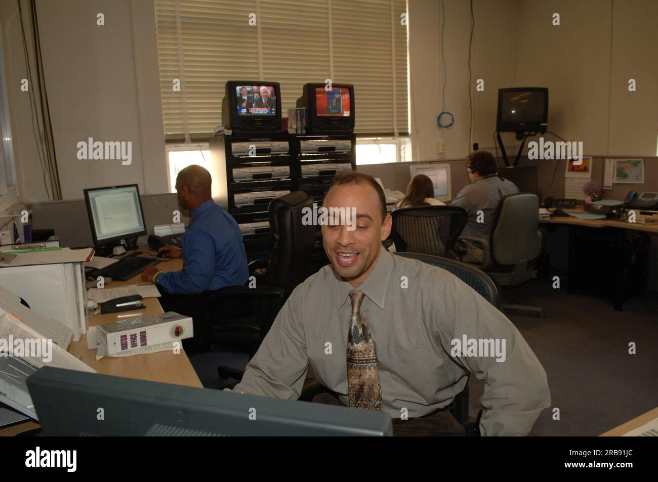 Staff at terminals, Interior Watch Office Stock Photo - Alamy