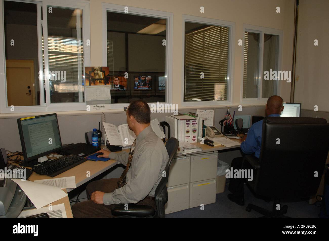 Staff at terminals, Interior Watch Office Stock Photo - Alamy