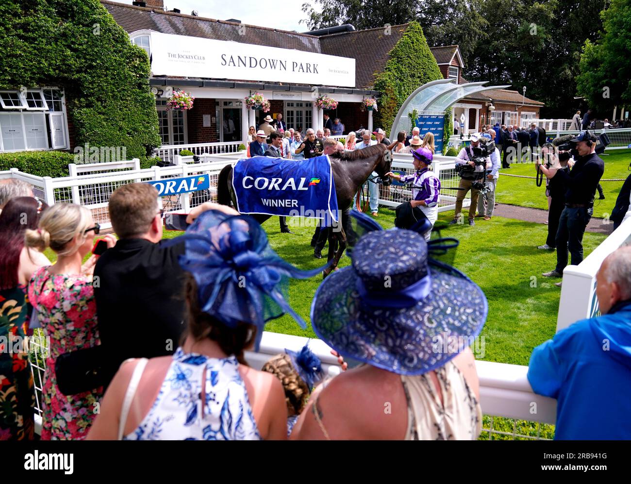 Jockey Tom Marquand and Perotto in the winners enclosure after winning ...