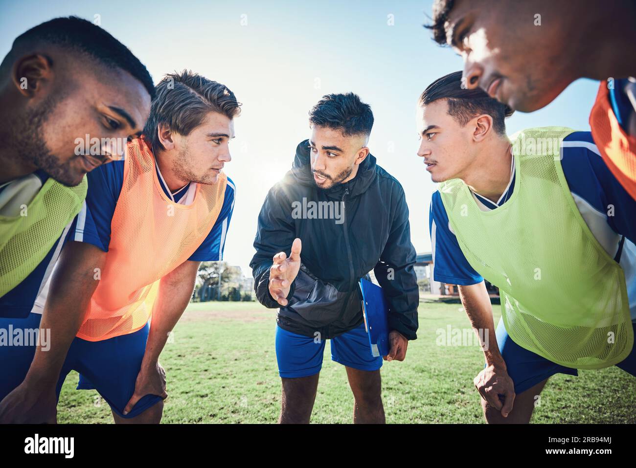 Coaching, football circle and people talking for sports teamwork ...