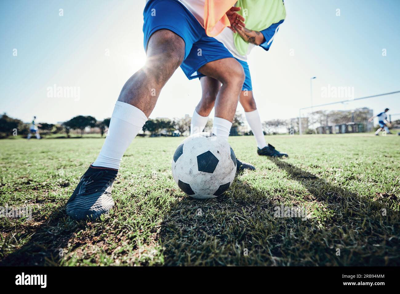 Football, challenge and men with action, grass and health with fitness ...