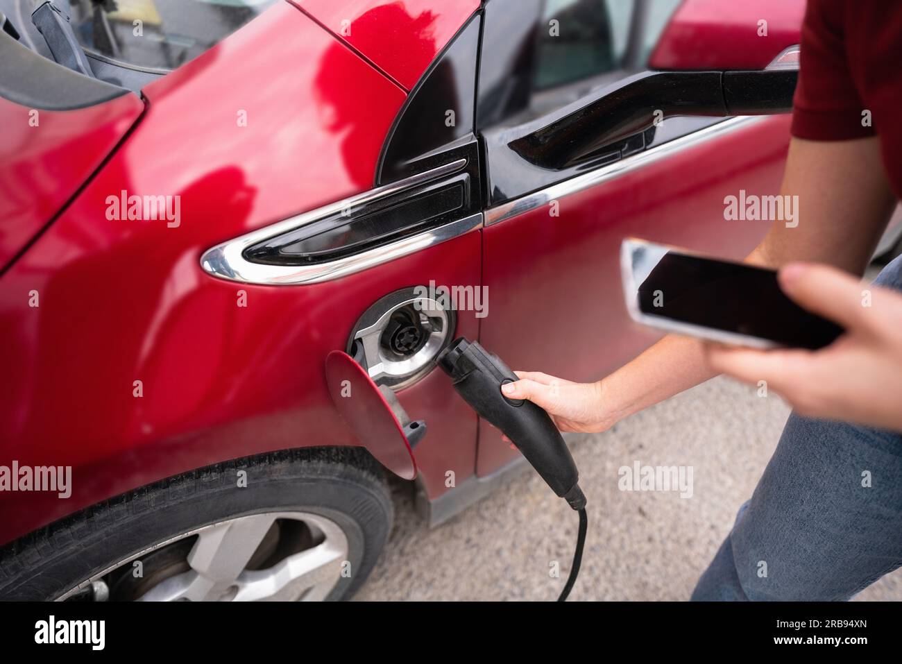 Red charging hi-res stock photography and images - Alamy
