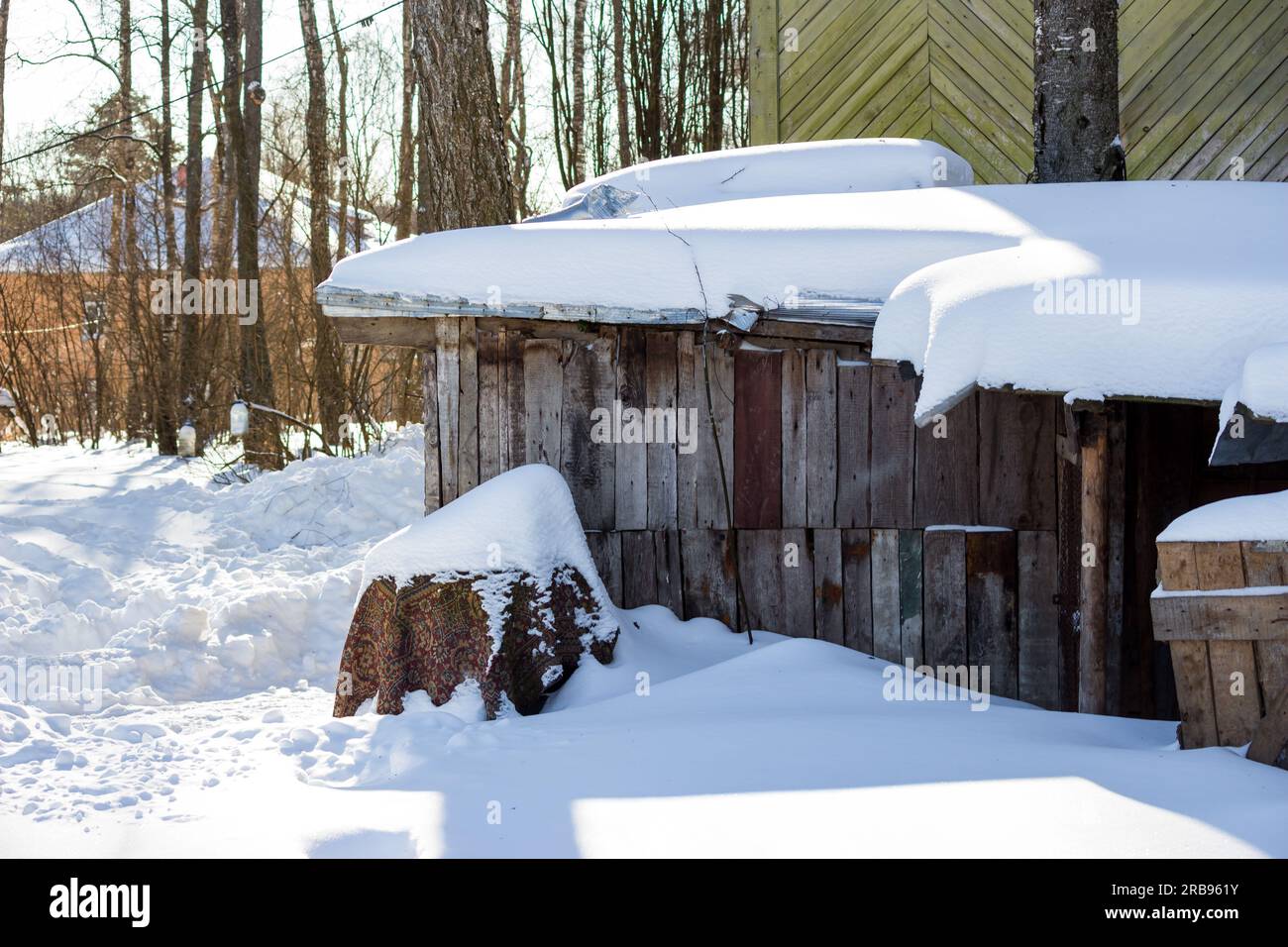 The roof of a wooden shed covered with snow after a long snowfall Stock ...