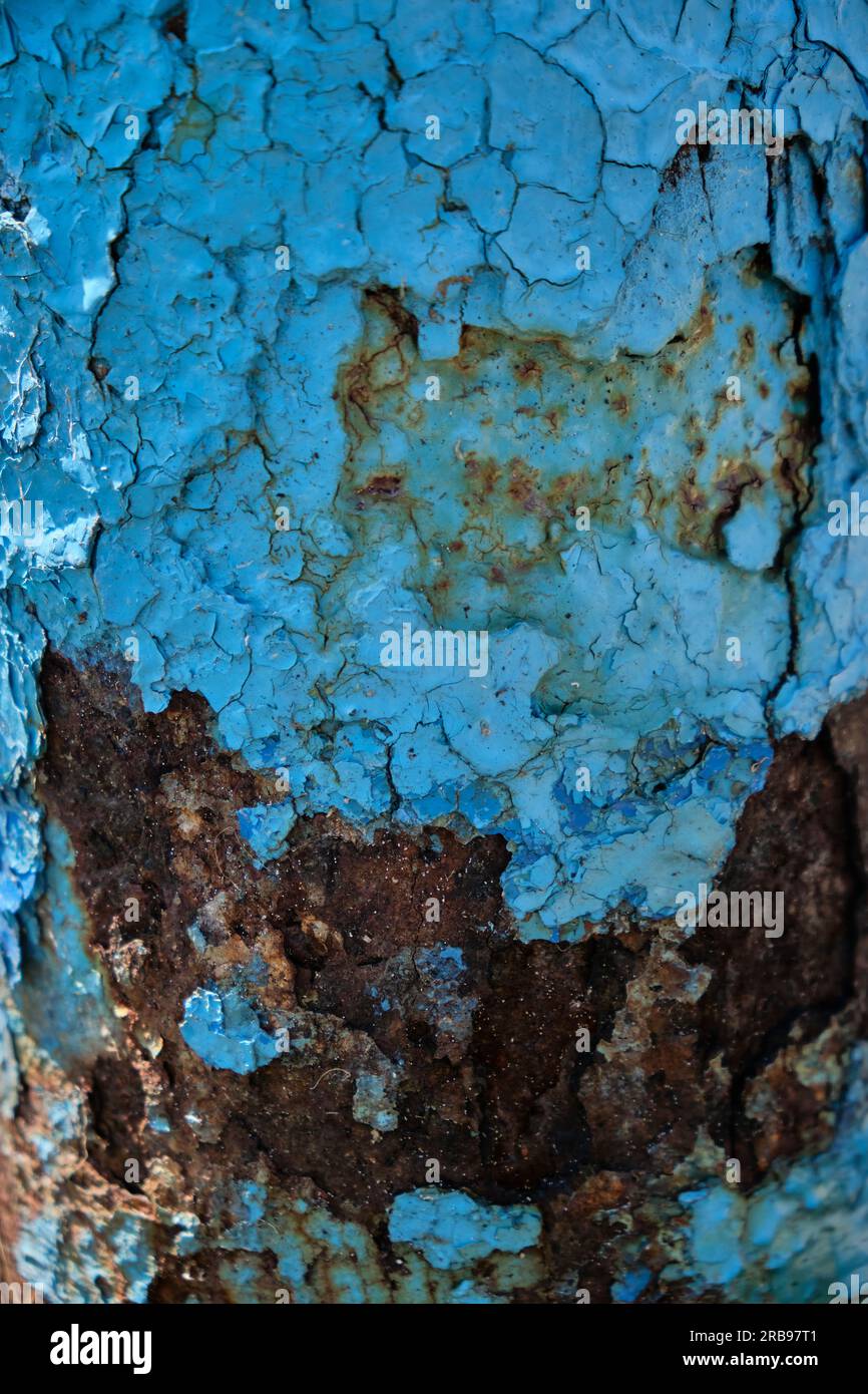 Rust on a blue surface. Cracks in the paint. Old iron. Rusty stains on ...