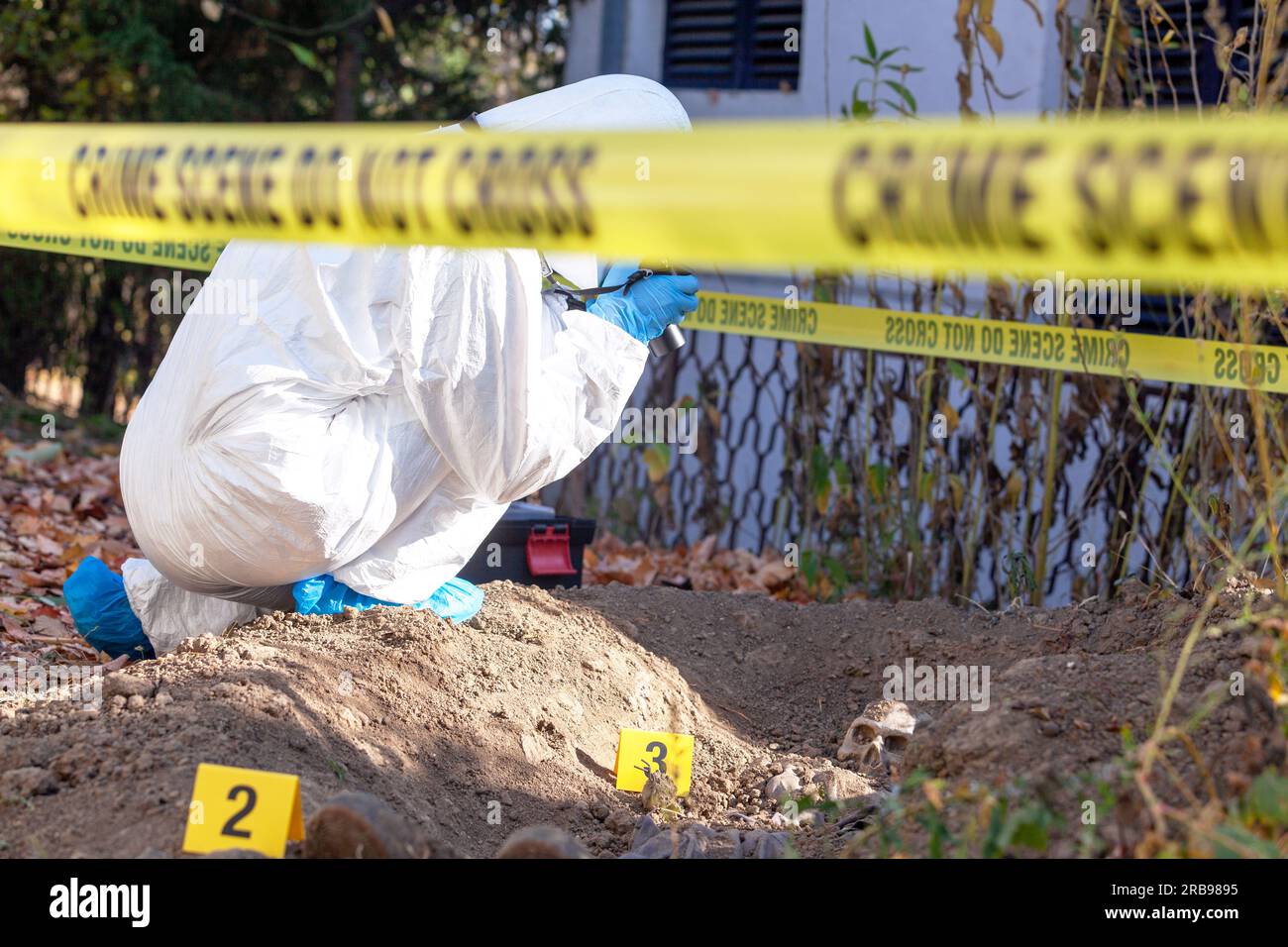 Forensic science specialist work at a war crime scene investigation ...