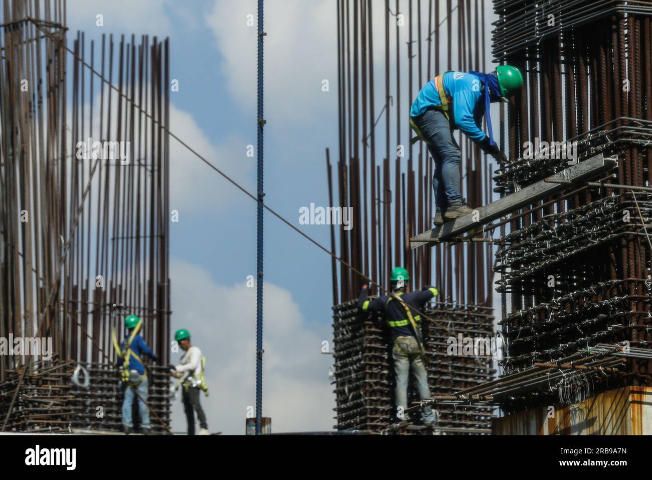 Quezon City, Philippines. 8th July, 2023. Workers are seen at a ...