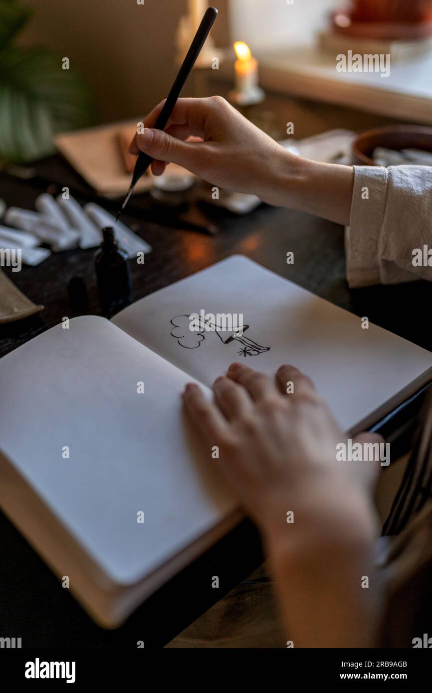 Creative work, passion, hobby. Artist sitting table with burning ...