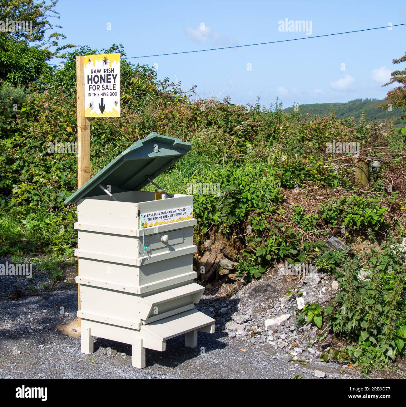Honesty box on roadside with Honey for sale Stock Photo - Alamy