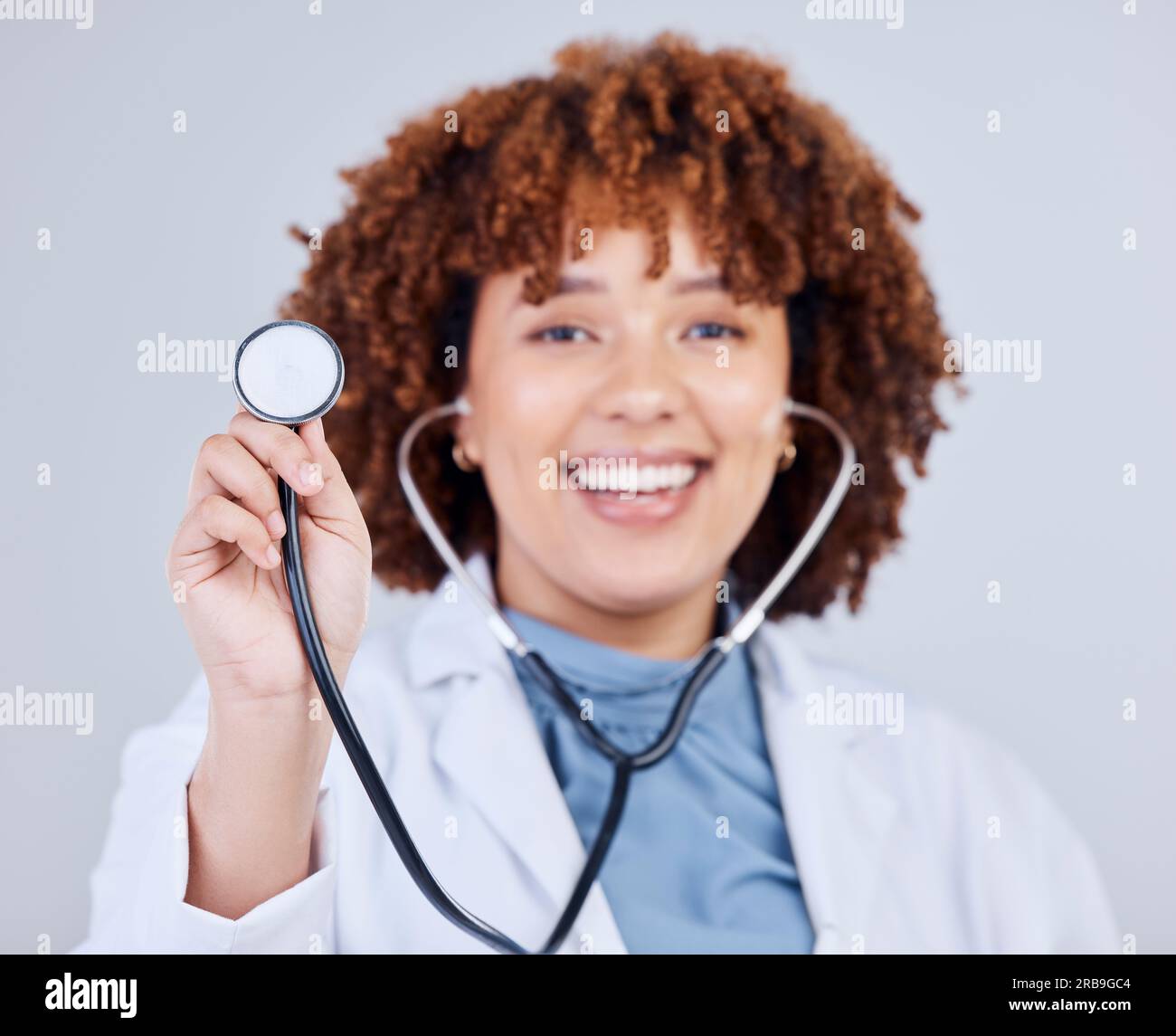 Healthcare, stethoscope and portrait of woman doctor in studio for ...