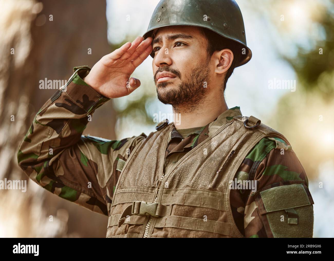 Soldier, military and man salute in nature for service, protection and ...