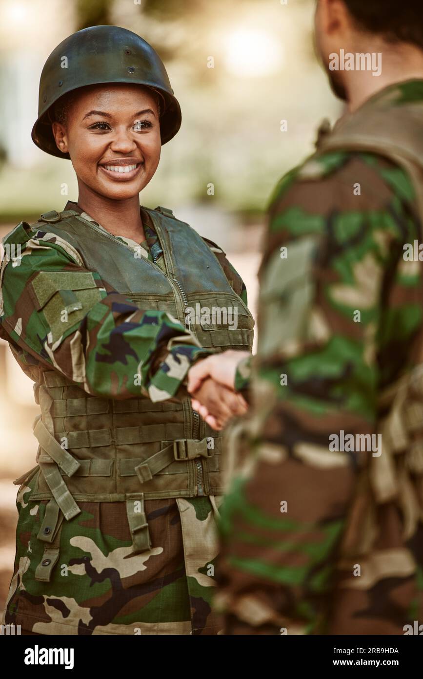 Soldier, army and man and woman with handshake in nature for service ...