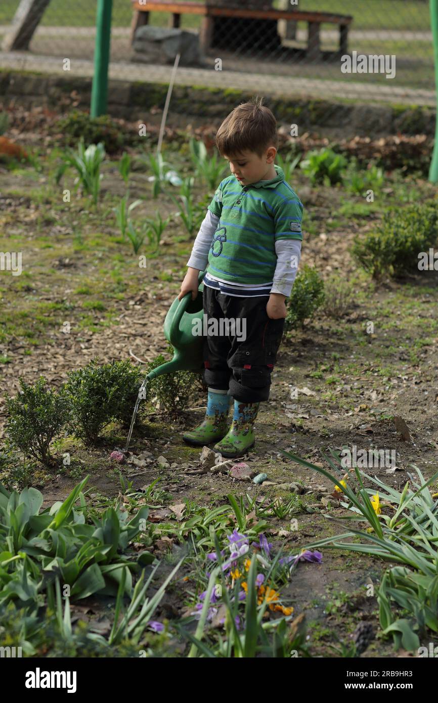 Watering children hi-res stock photography and images - Alamy