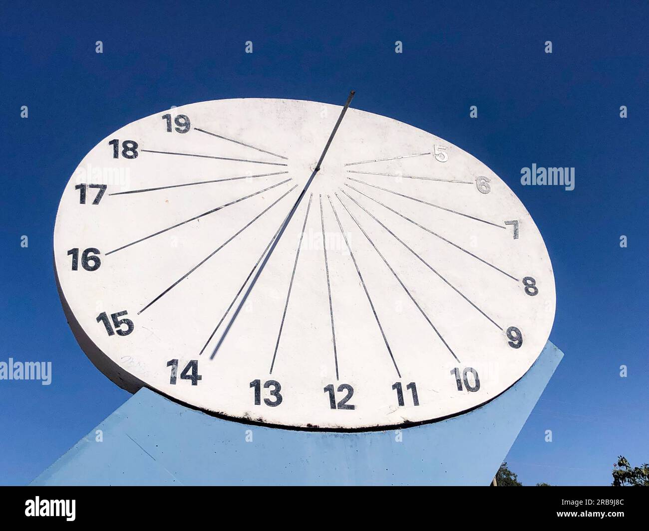 Traditional sun clock keeping time around 14:00h Stock Photo - Alamy