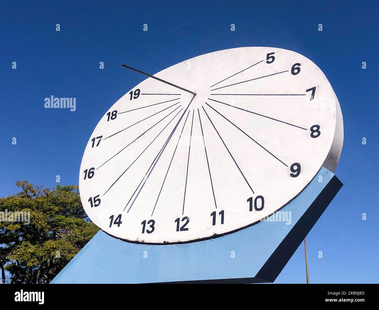 Traditional sun clock keeping time around 14:00h Stock Photo - Alamy