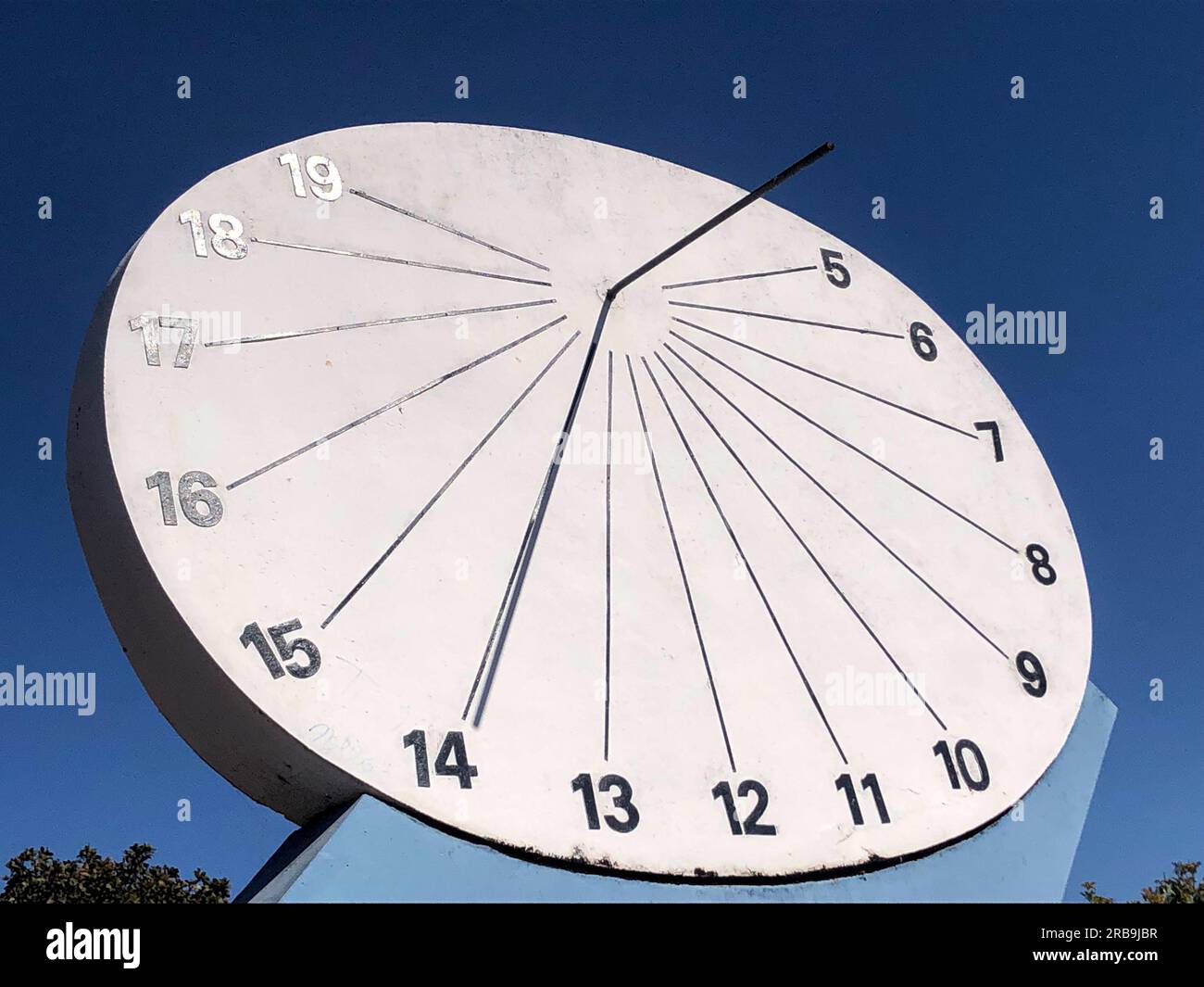 Traditional sun clock keeping time around 14:00h Stock Photo - Alamy