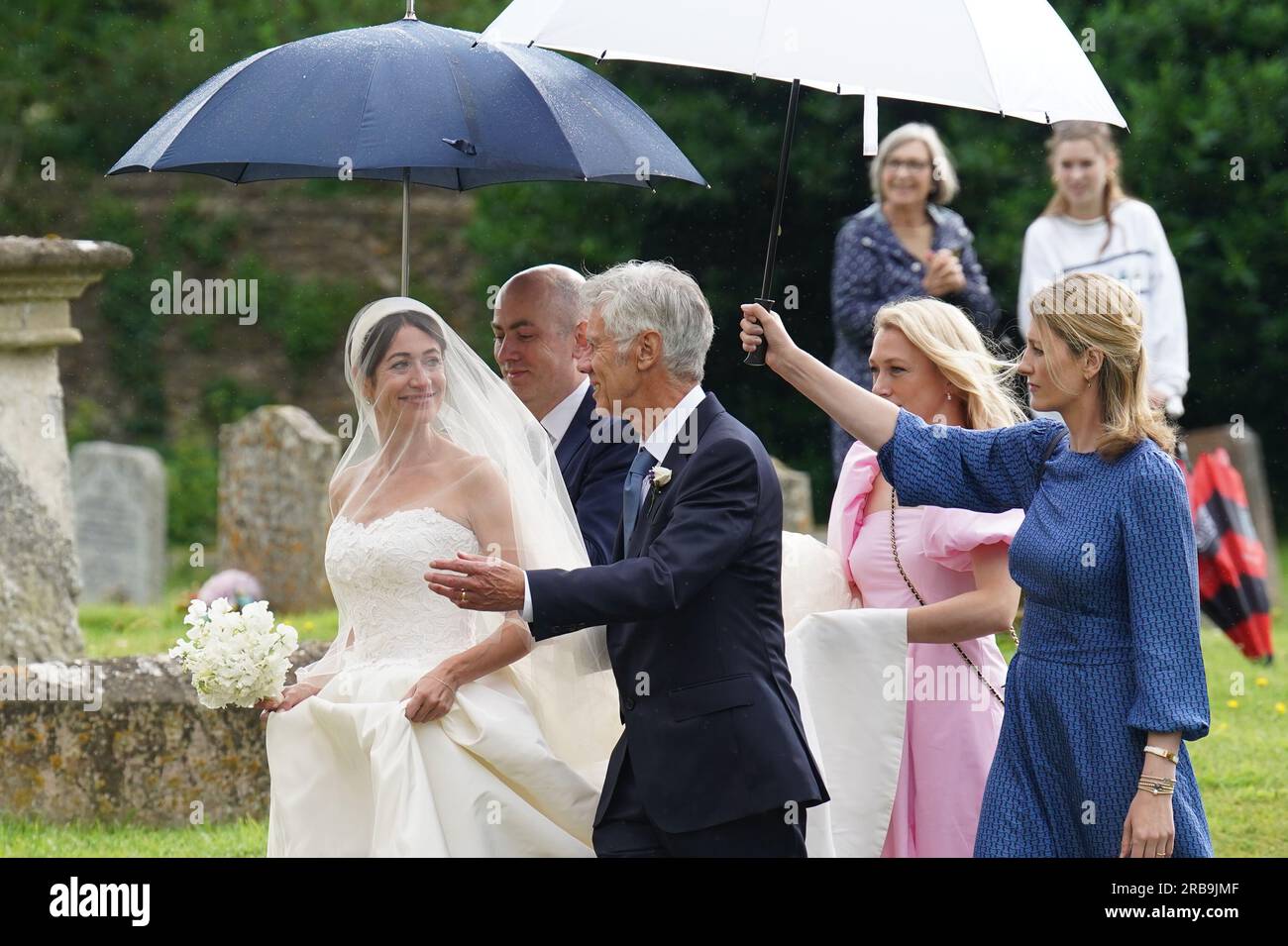 Thea Rogers arrives at St Mary's Church in Brunton, Somerset, with her ...