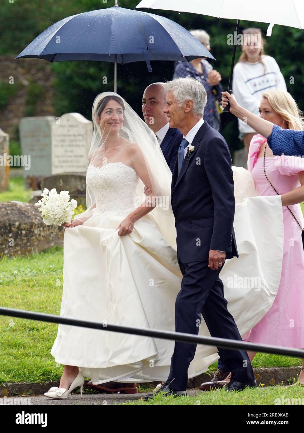Thea Rogers arrives at St Mary's Church in Brunton, Somerset, with her ...