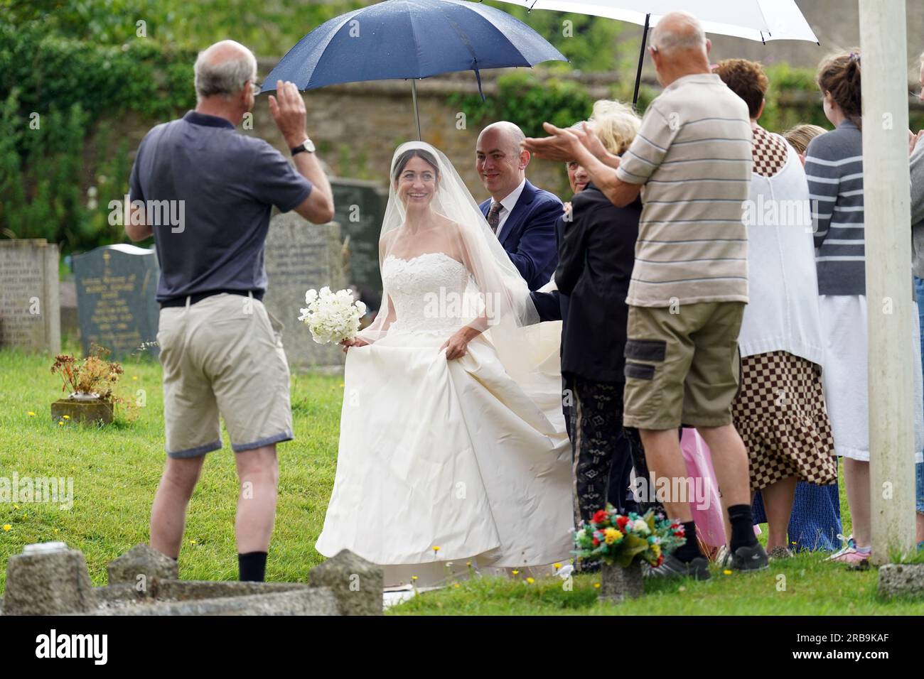 Thea Rogers arrives at St Mary's Church in Brunton, Somerset, with her ...