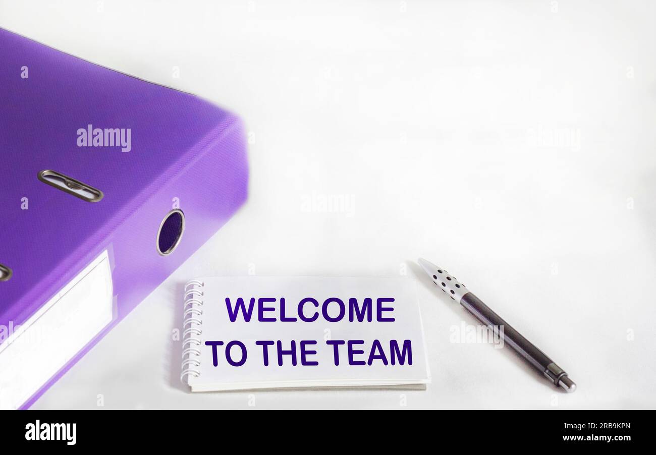 WELCOME TO THE TEAM Text concept written on notepad with office tools ...