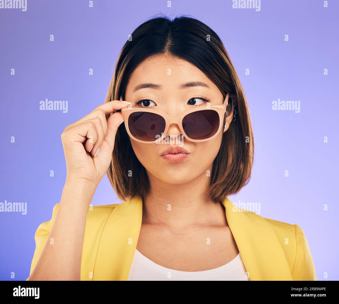 Fashion, sunglasses and a model asian woman on a purple background in ...