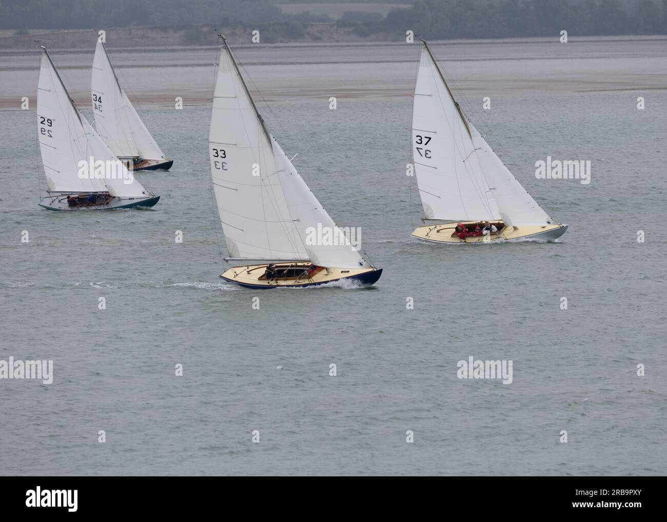 Four Fife One Design yachts sailing off Beaumaris in the Menai Straits ...