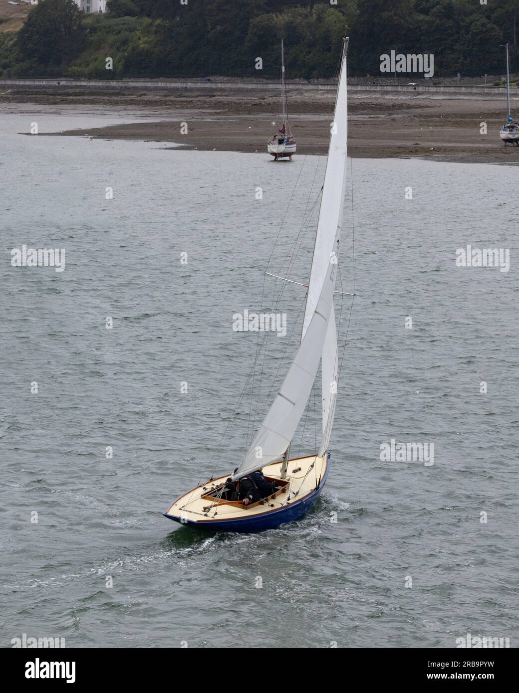 A Fife One Design yacht sailing off Beaumaris in the Menai Straits ...