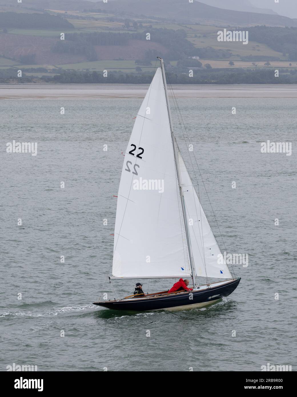 A Fife One Design yacht sailing off Beaumaris in the Menai Straits ...