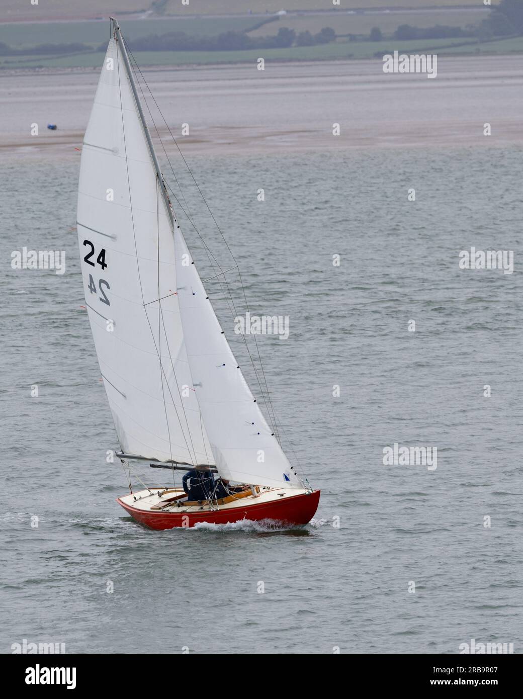 A Fife One Design yacht sailing off Beaumaris in the Menai Straits ...