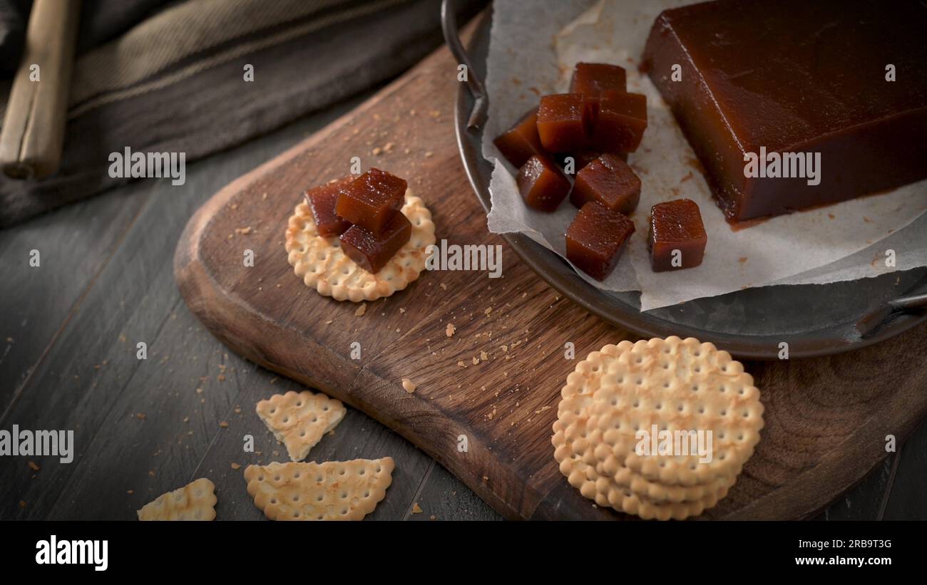 Marmalade in crackers on a kitchen counter with quinces and cheese ...