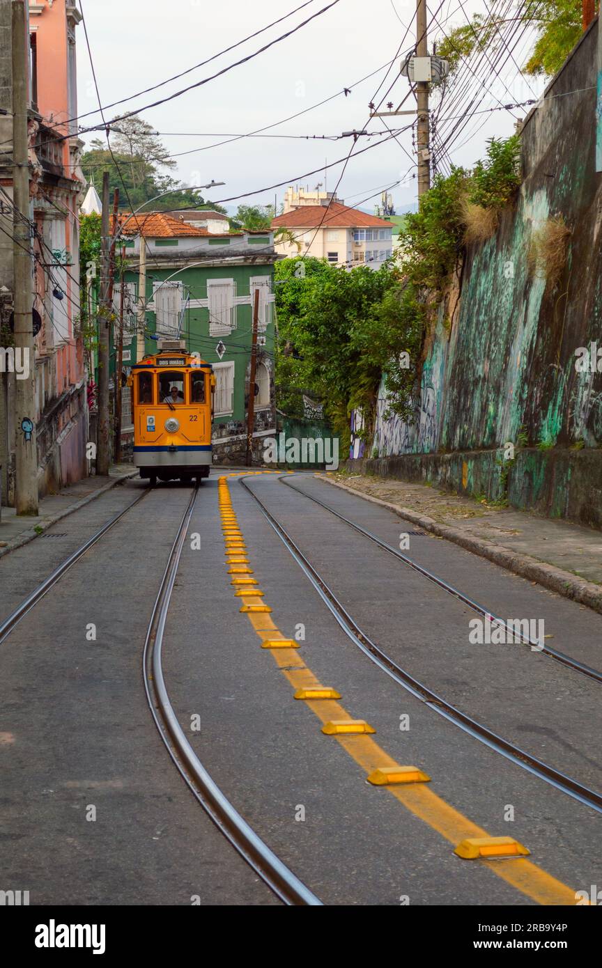 Yellow vintage tramway going up hill in Santa Teresa neighborhood in ...