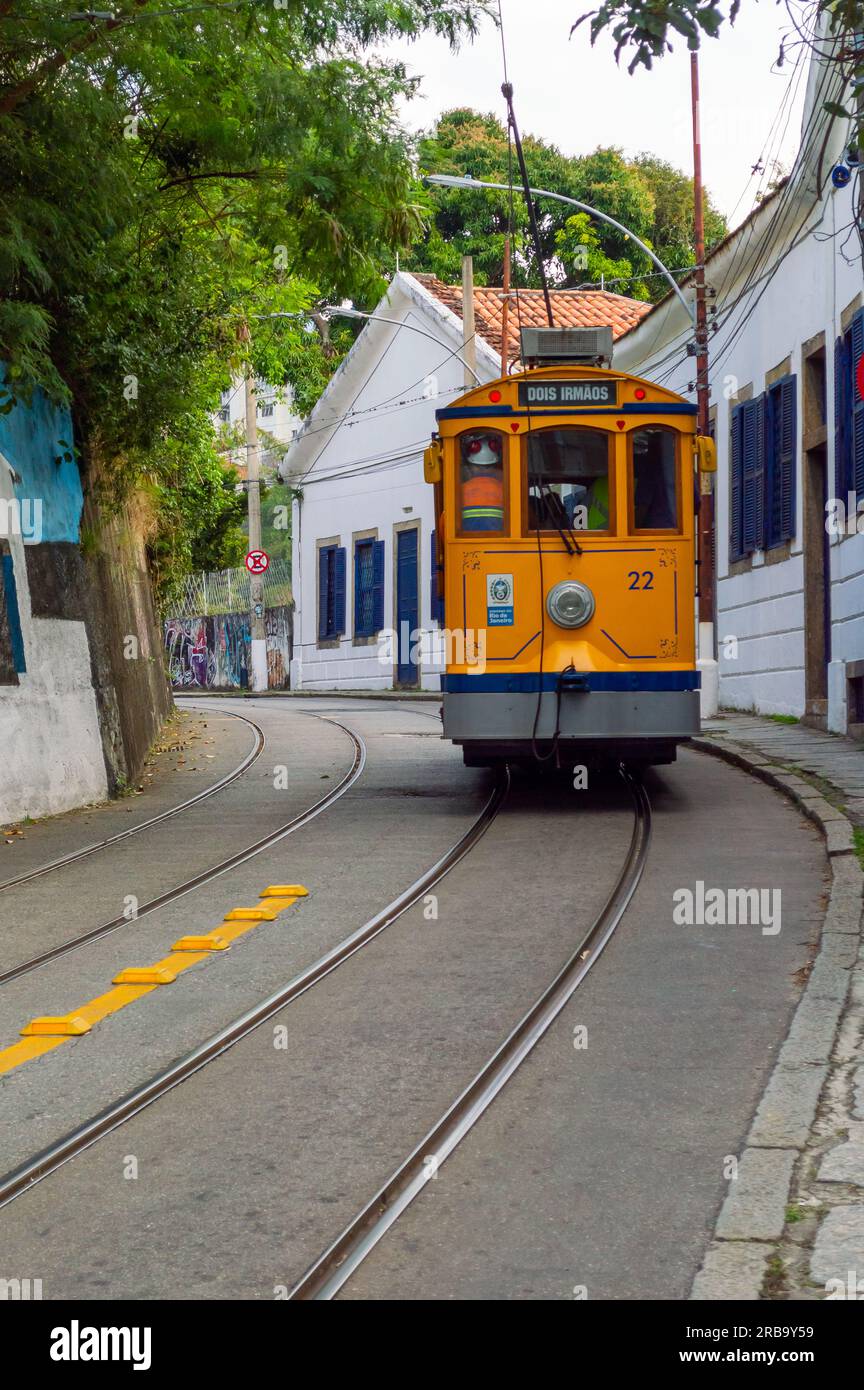 Yellow vintage tramway going up hill in Santa Teresa neighborhood in ...