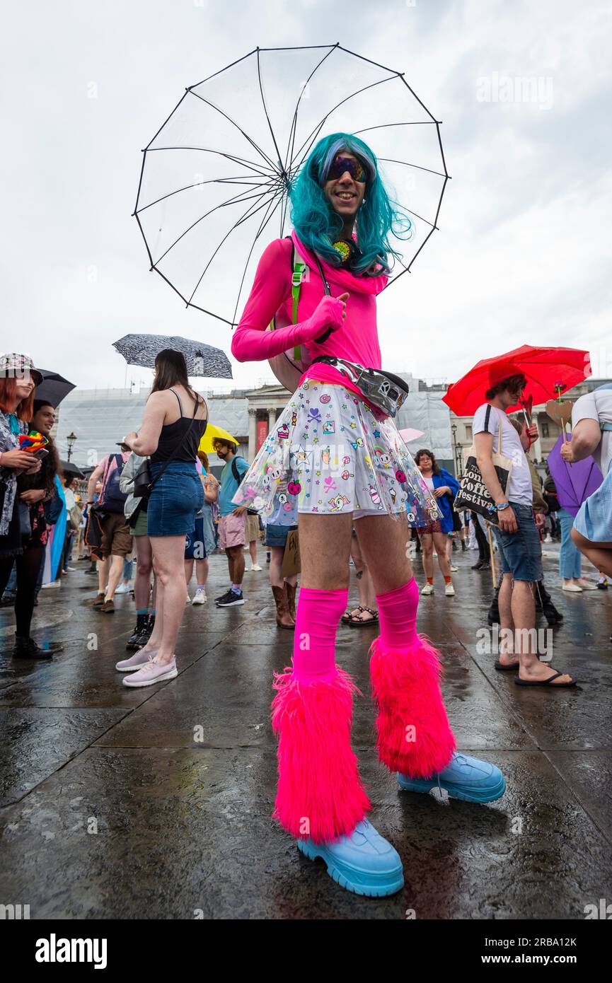 London, UK. 8 July 2023. A person in costume in the rain in Trafalgar ...