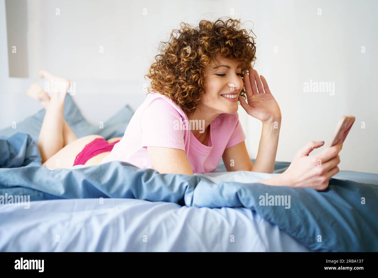Smiling positive woman talking via hi-res stock photography and images ...