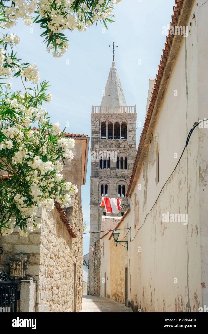 Bell tower of St. Mary's church and narrow street of the old town of ...