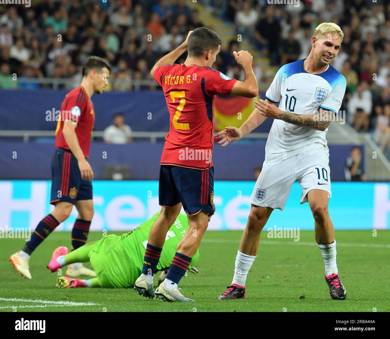 Spain goalkeeper Arnau Tenas saves a shot from England's Emile Smith ...