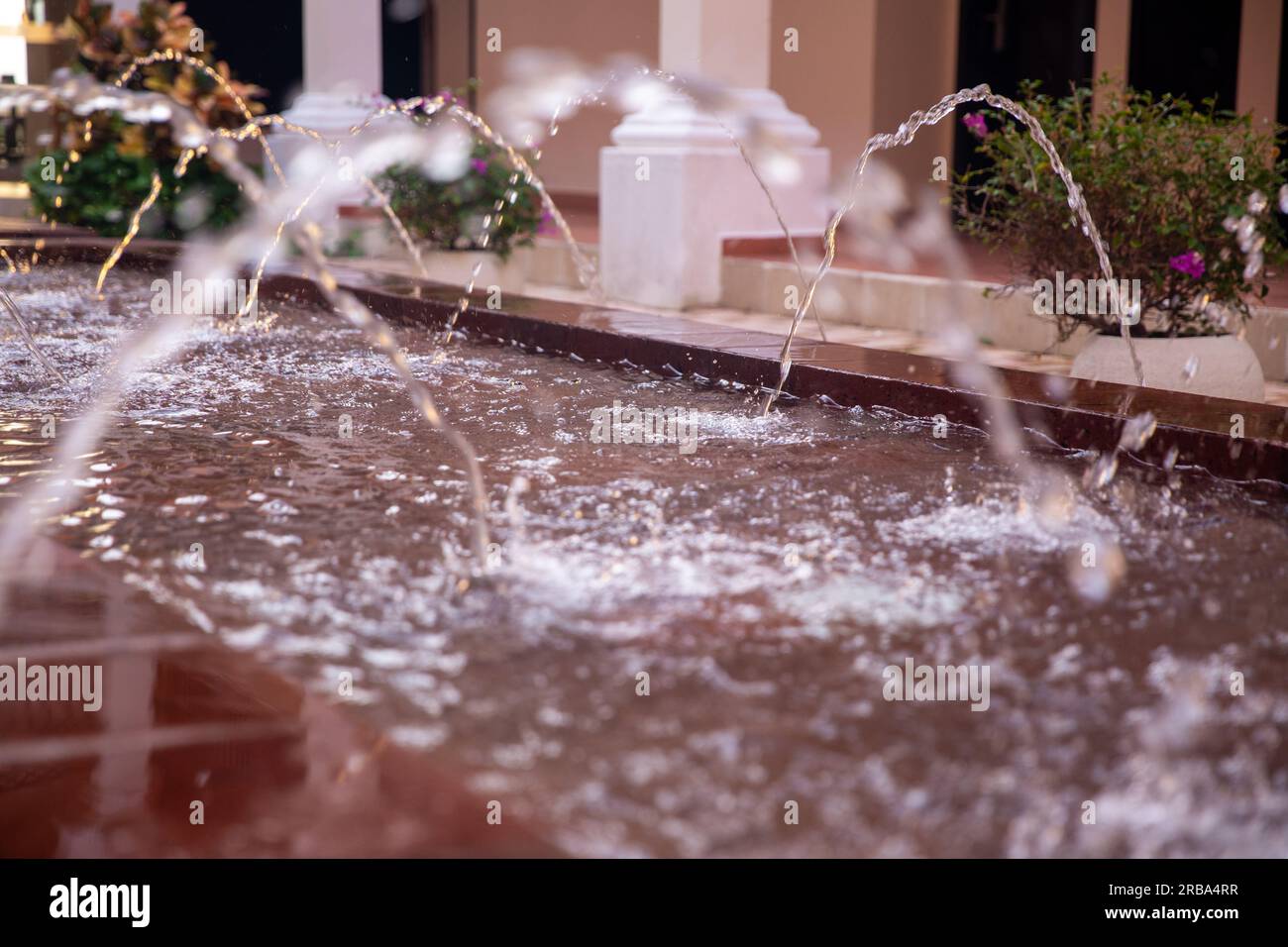 Mini water fountains on display in a courtyard Stock Photo - Alamy