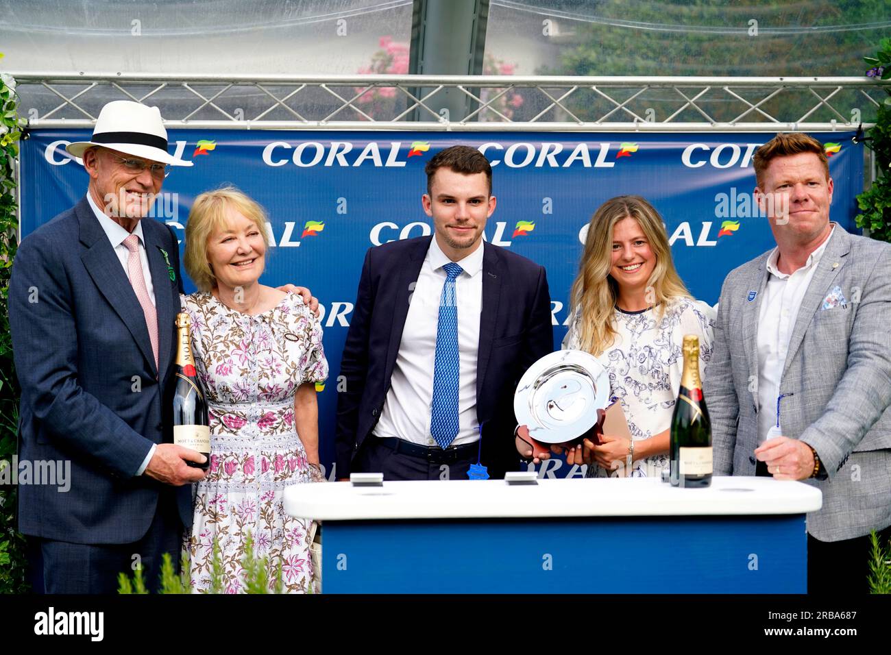 Trainer John Gosden, his wife Rachel Hood and the winning connections ...