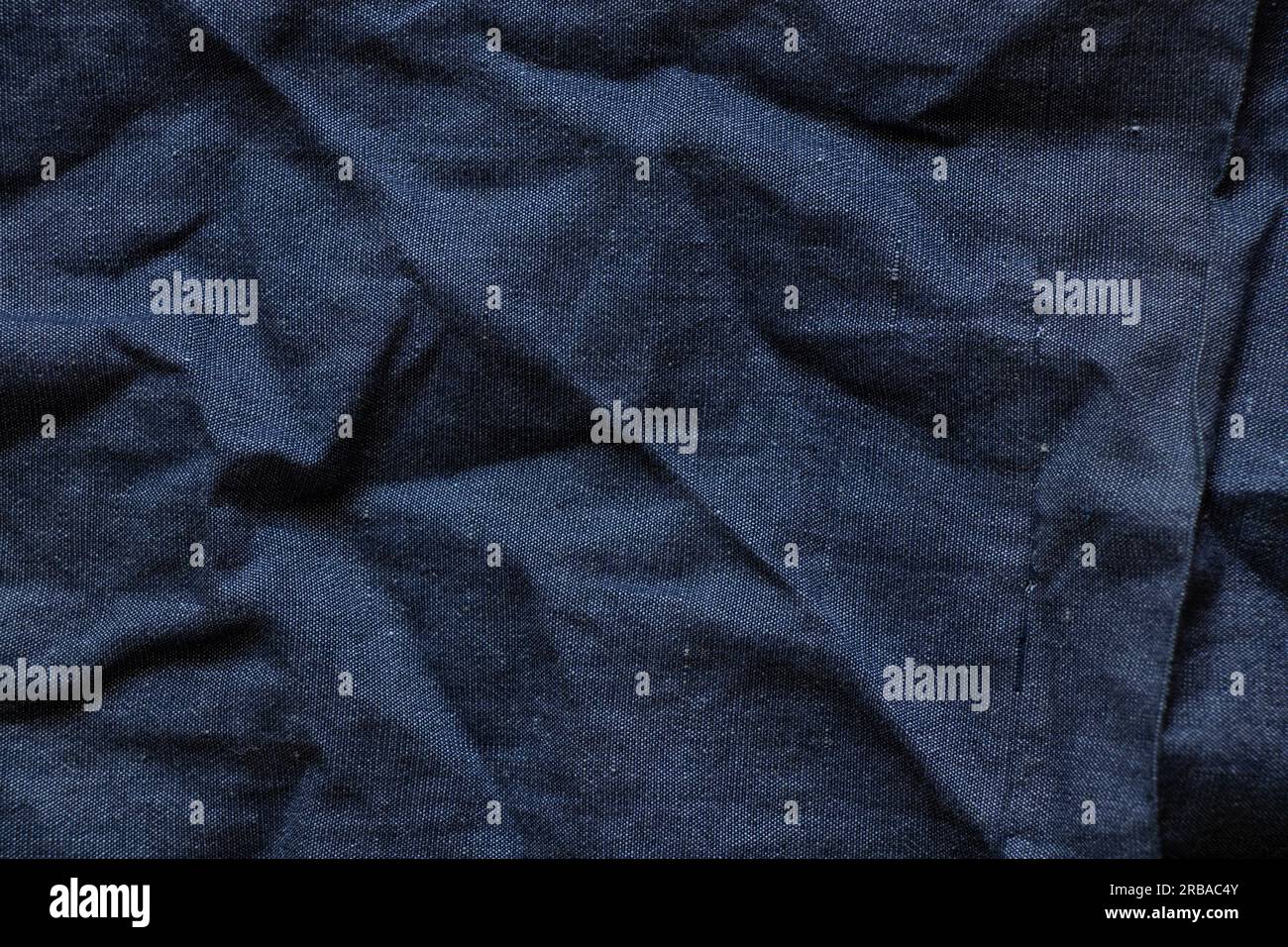 blue wrinkled dark fabric as background close up close up Stock Photo ...