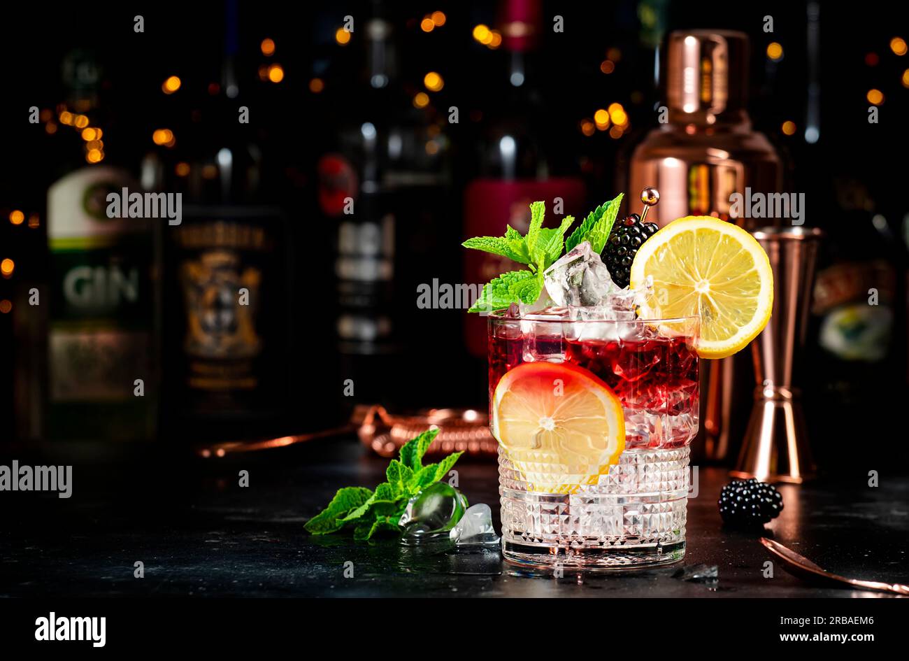 Bramble alcohol cocktail drink with dry gin, liqueur, syrup, lemon ...