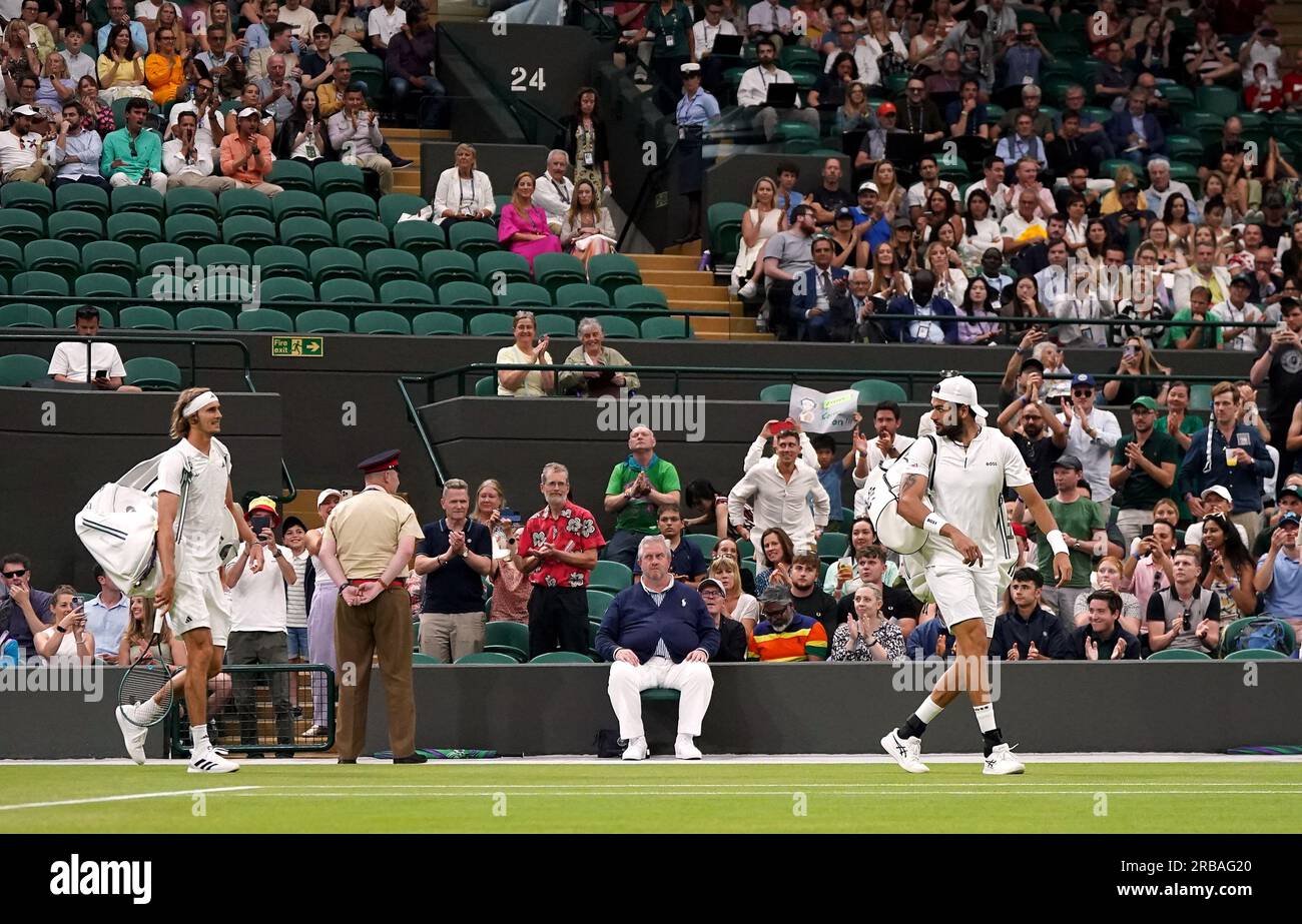 Matteo Berrettini and Alexander Zverev walk back on to court one after ...